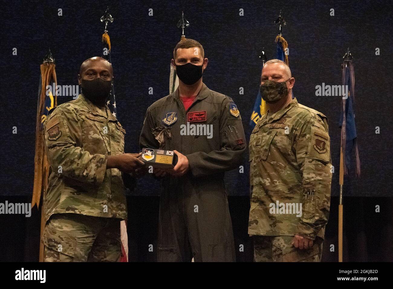 Lt. Col. Ripley Haussler accepts the 51st Fighter Wing Airman of the ...
