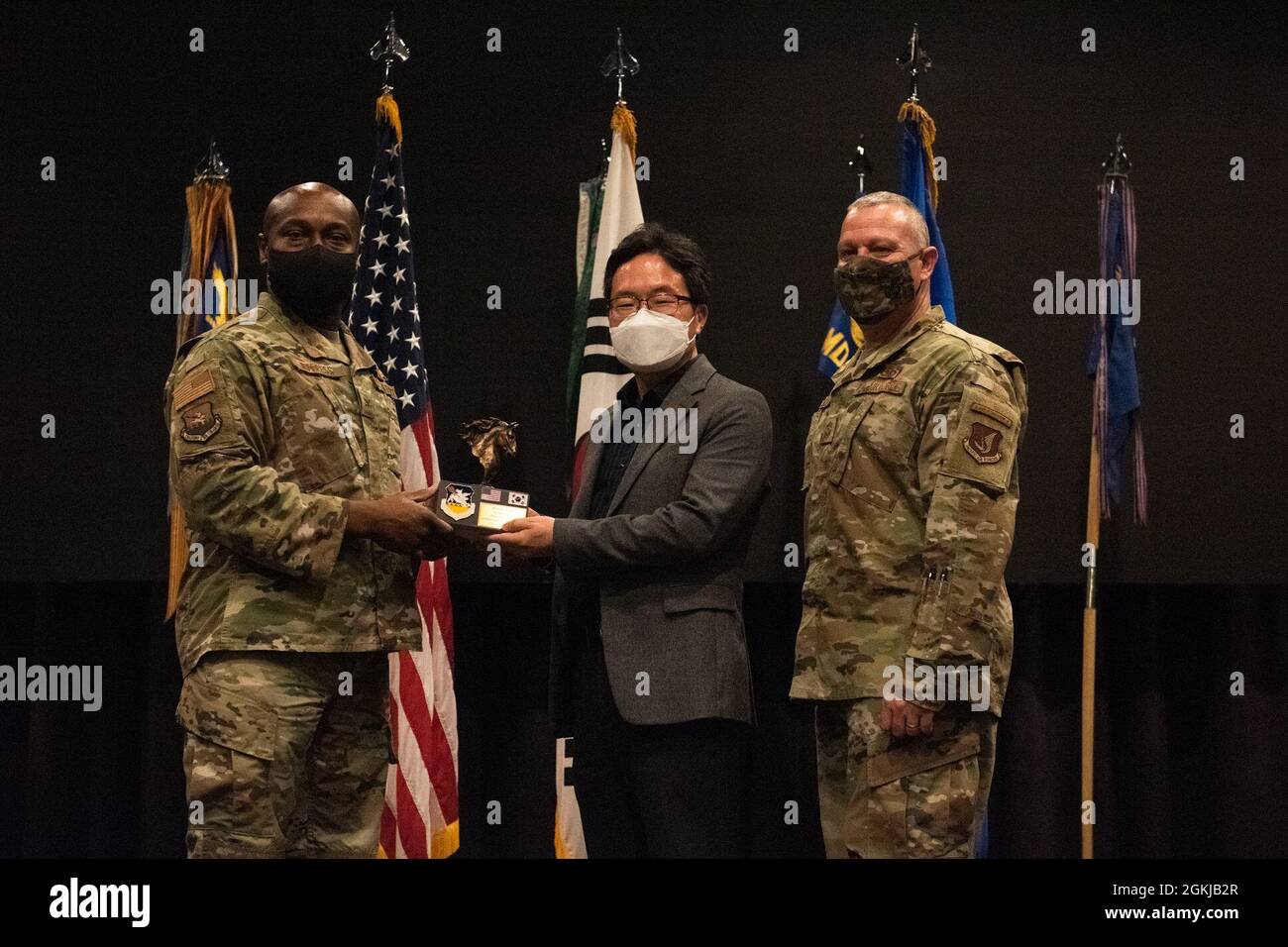Mr. Hyong Kil Kim, 51st Medical Group, accepts the 51st Fighter Wing ...