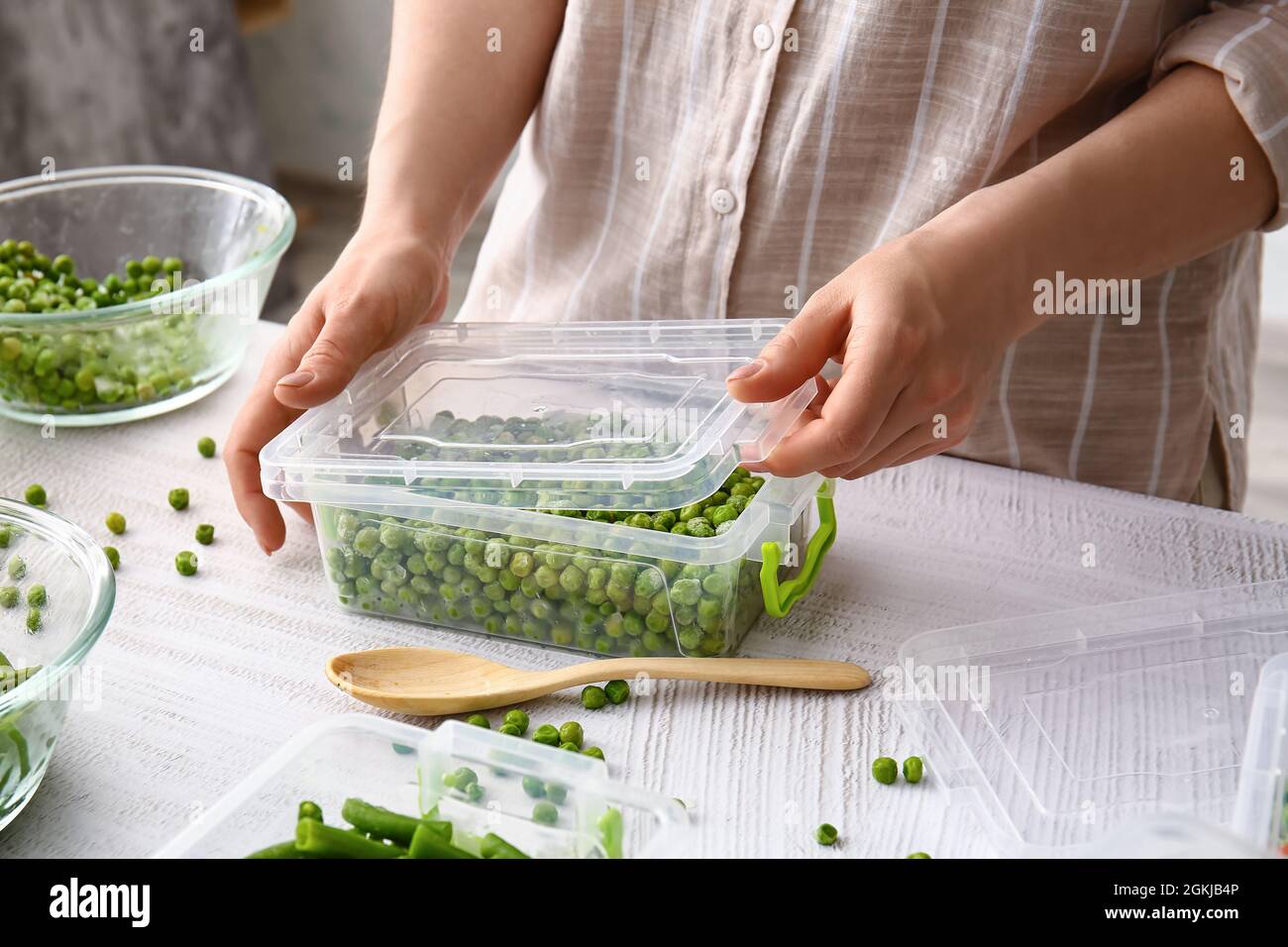 Woman closing plastic container hi-res stock photography and images - Alamy