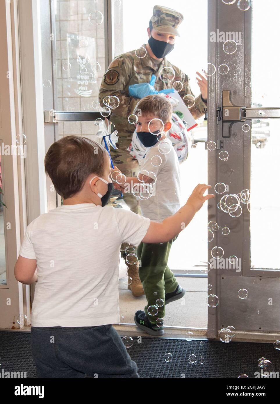 Ryder, foreground, and Ronin McCool chase bubbles as they depart the ...