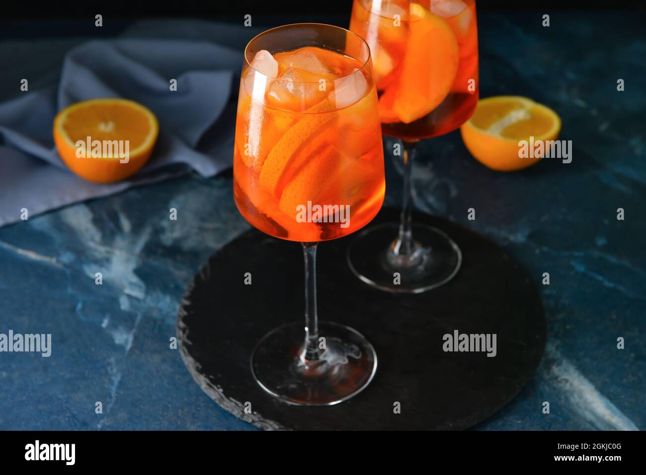 Glasses of tasty aperol spritz cocktail on color background Stock Photo ...