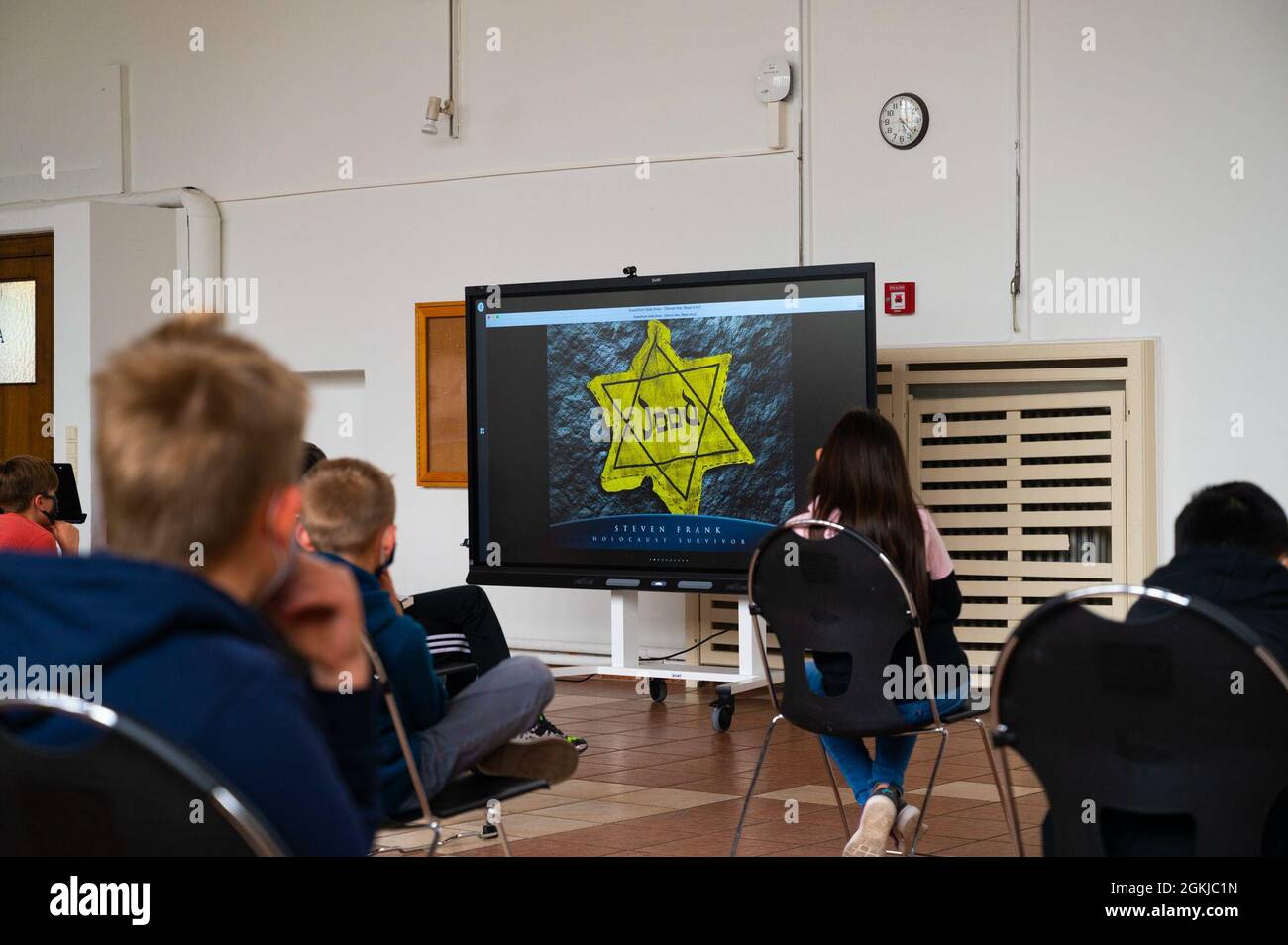 Department of Defense Education Activity students look at an image of a ...