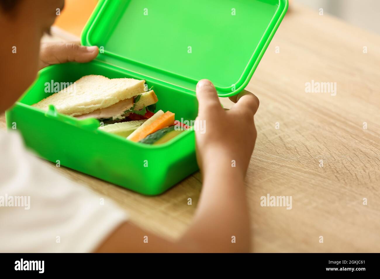 Cute little child having lunch at school, closeup Stock Photo - Alamy