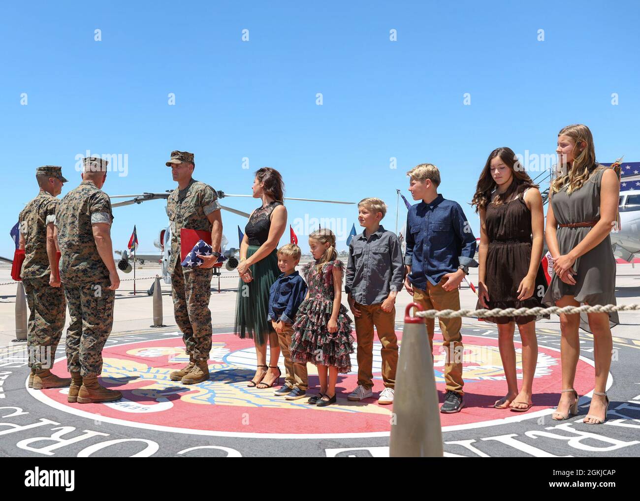 Lt. Col. Jim Paxton stands with his family during a retirement ceremony ...
