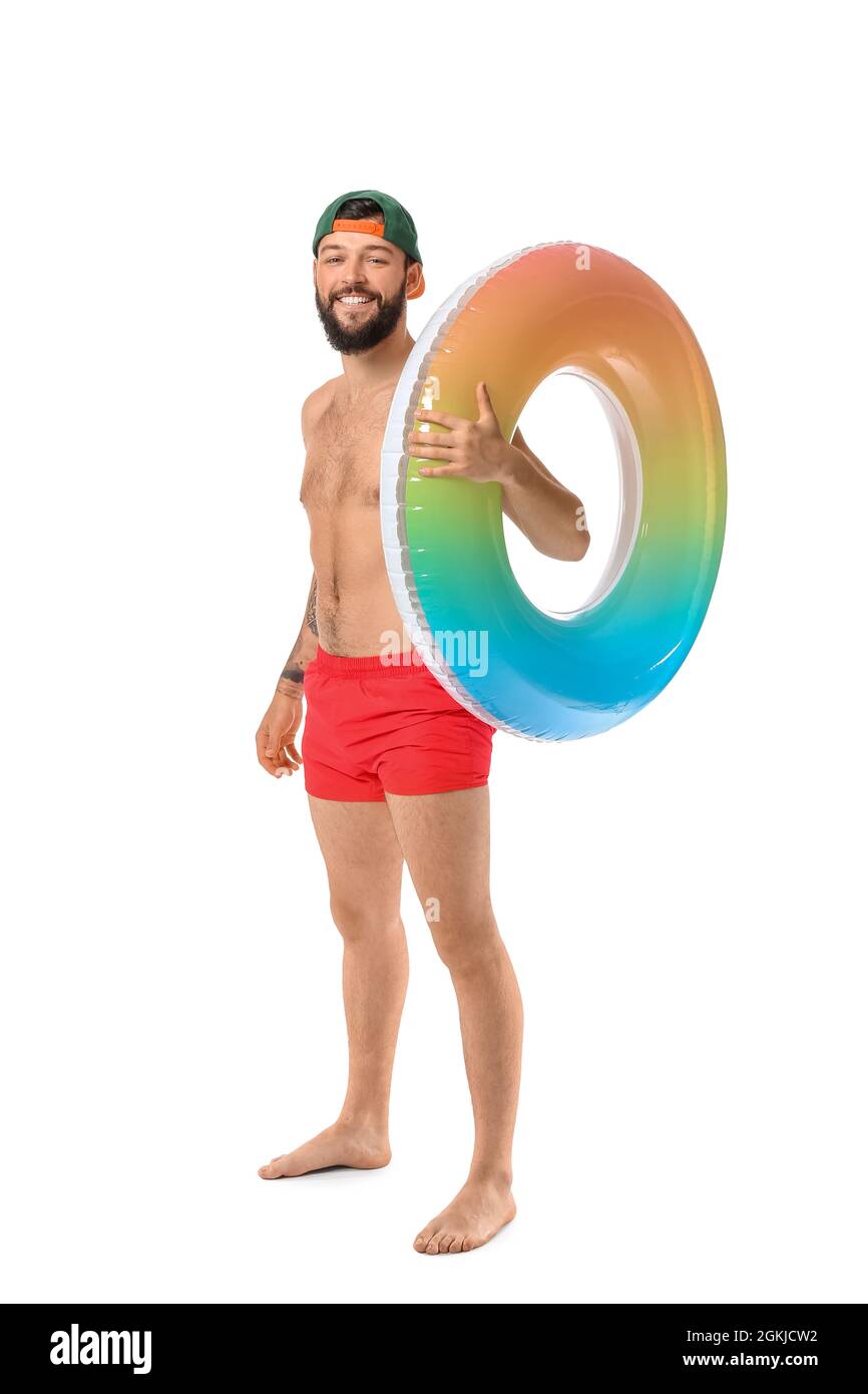 Young man with inflatable ring on white background Stock Photo - Alamy