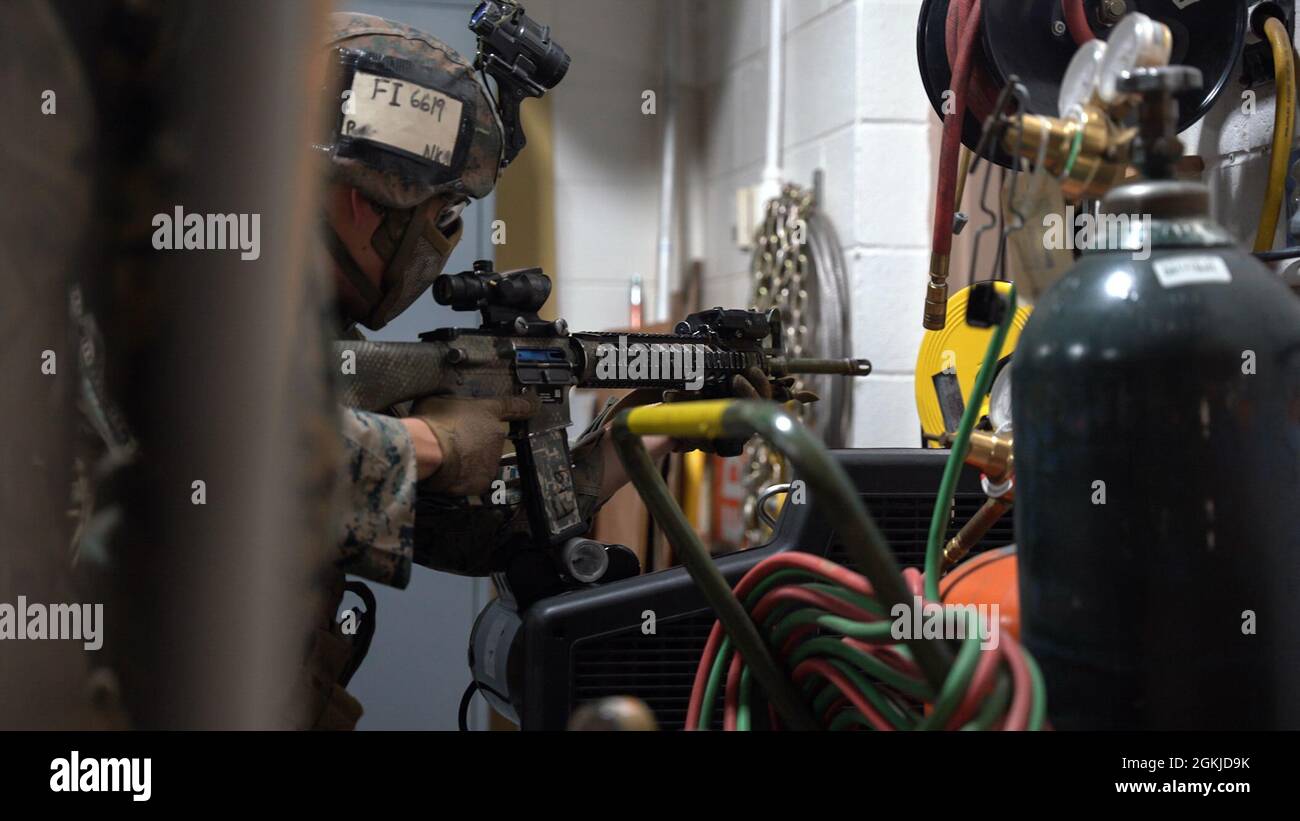 A Marine acting as host-nation military member provides security during ...