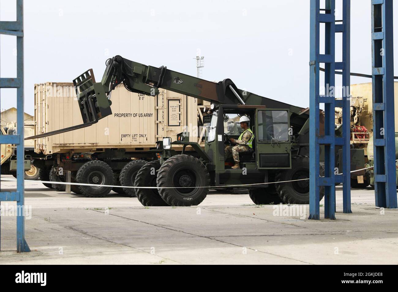 A U.S. Army Soldier drives a forklift across Durres Port on May 1. U.S ...