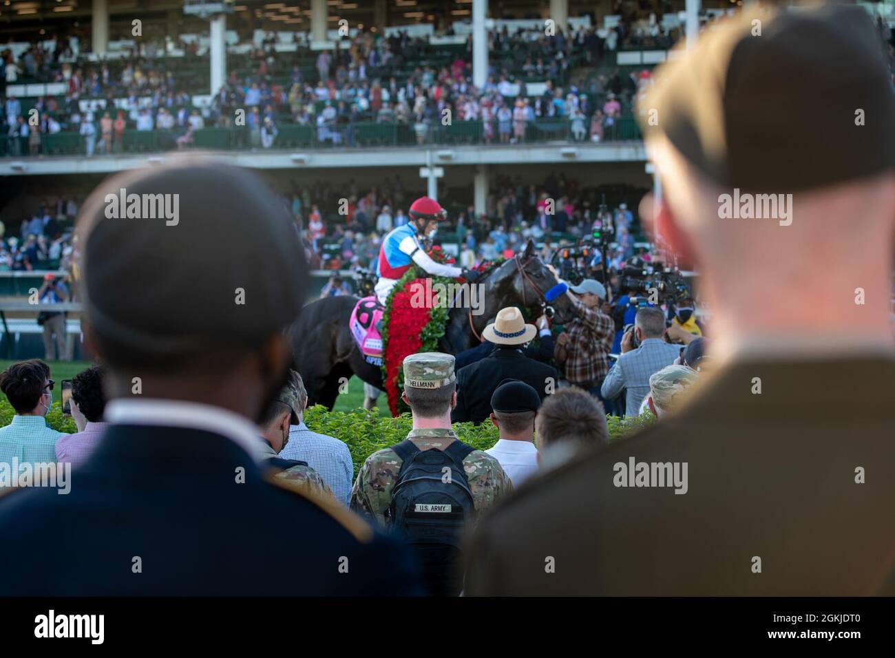 Soldiers from the 75th Troop Command watch as the Kentucky Derby winner ...