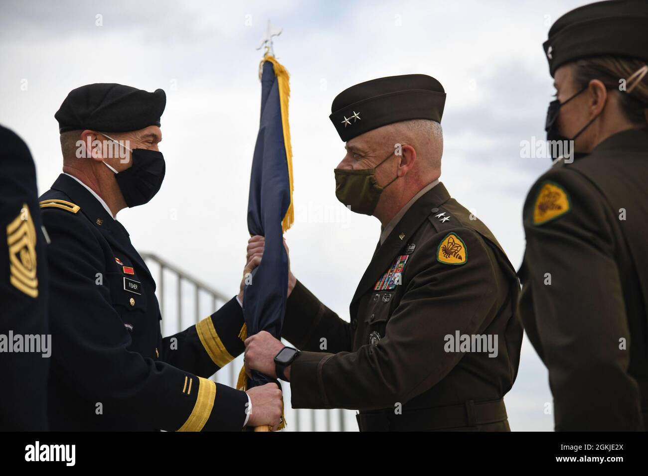 Brig. Gen Thomas Fisher passes the organizational colors to Maj. Gen ...
