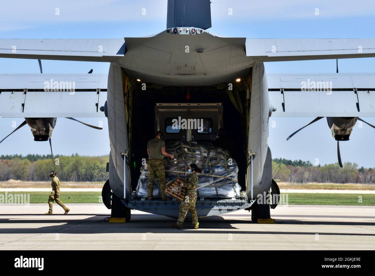 Airmen assigned to the 61st Airlift Squadron prepare to offload cargo ...