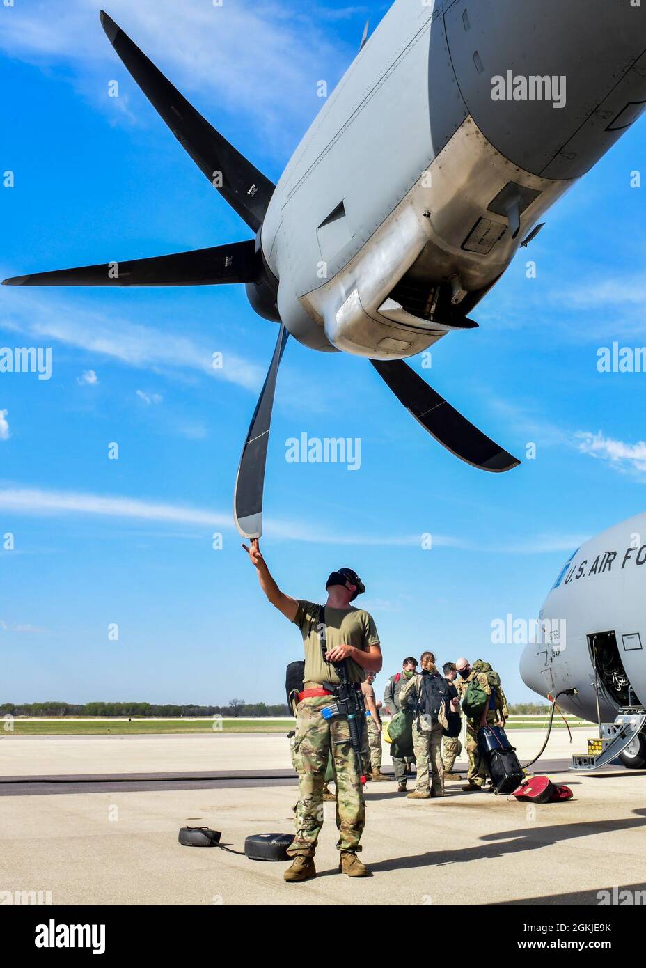 An Airman assigned to the 19th Airlift Wing examines a C-130J Super ...