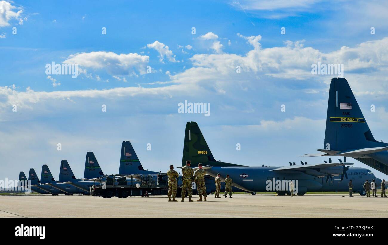 Eight C-130J Super Hercules are parked on the flightline at Volk Field ...