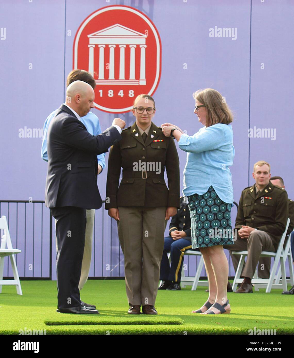 2nd Lt. Samantha Renson receives her bars from her parents, Eileen and ...