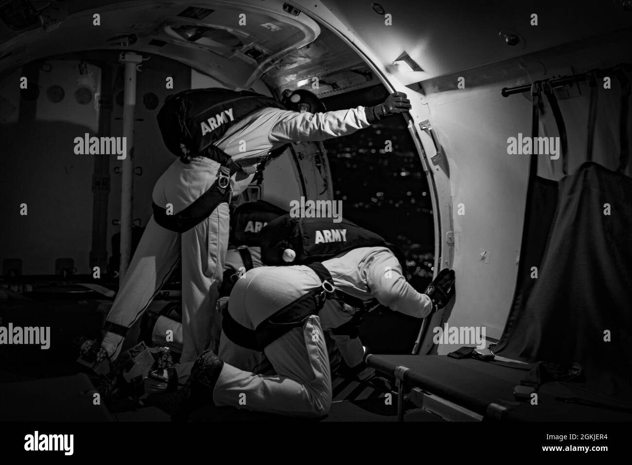 Members of the USAPT demonstration team prepare for night jump ...
