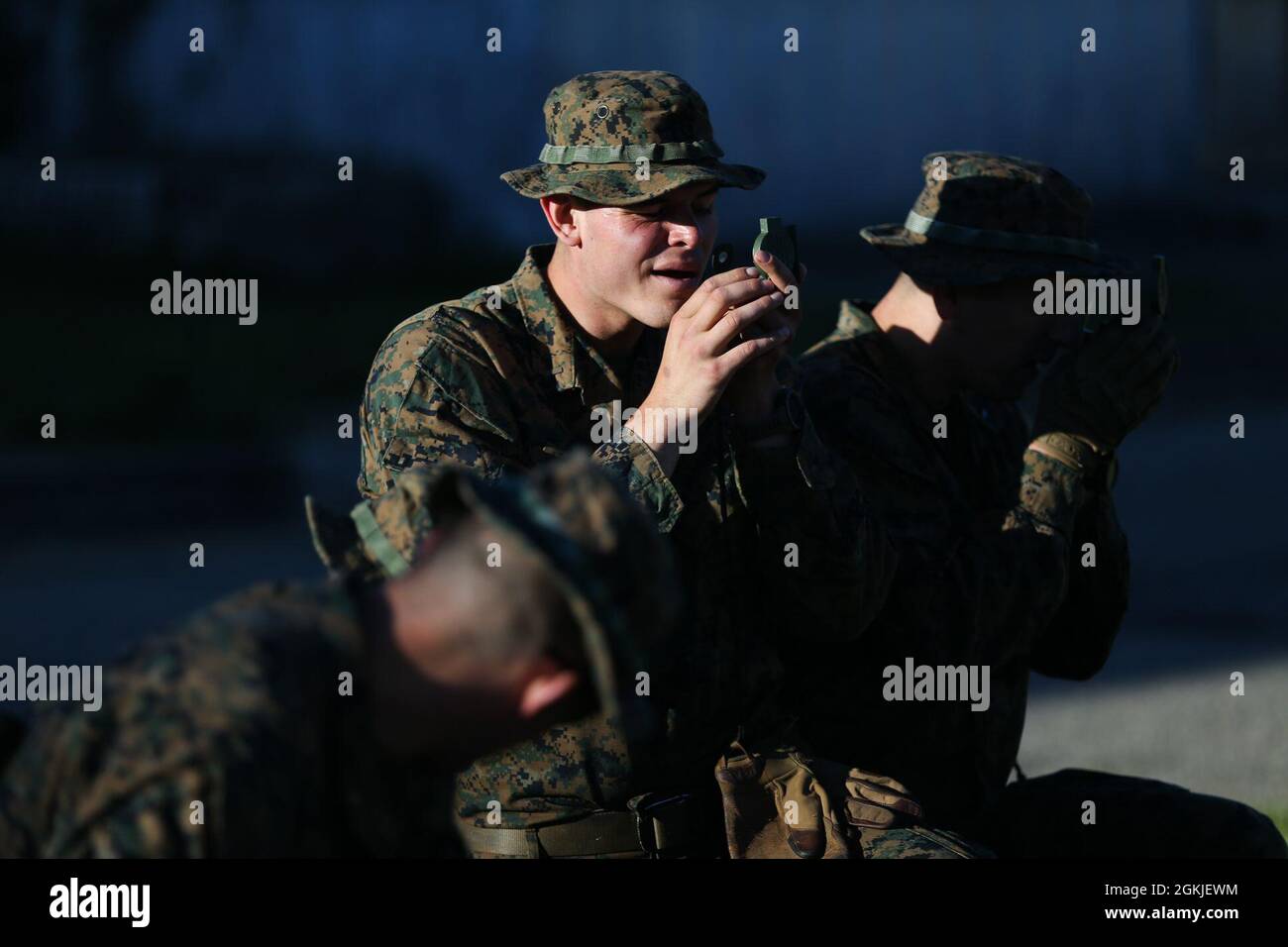 U.S. Marines with The Basic School shoot an azimuth while competing in ...