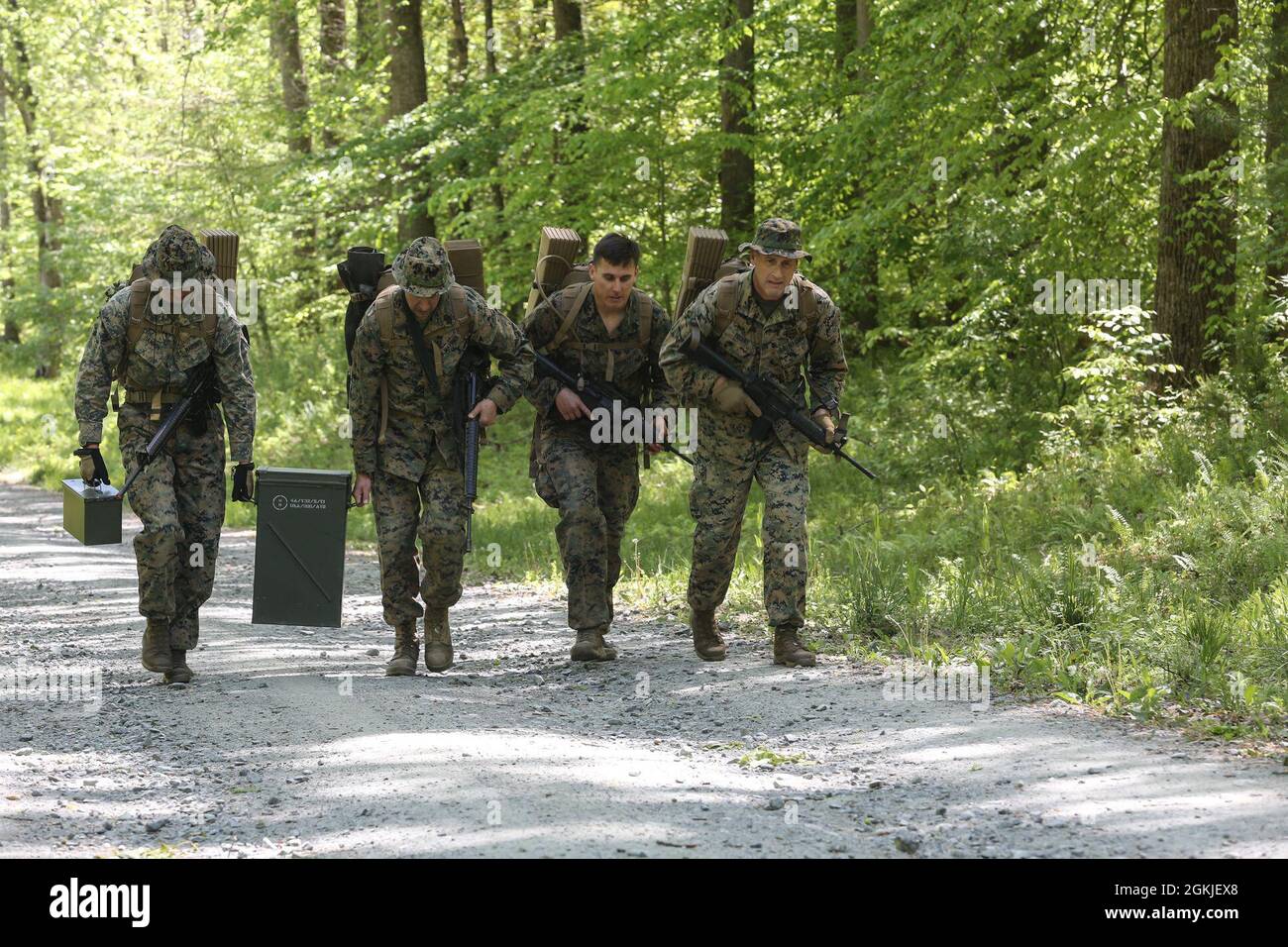U.S. Marines with The Basic School conduct an ammo resupply run while ...