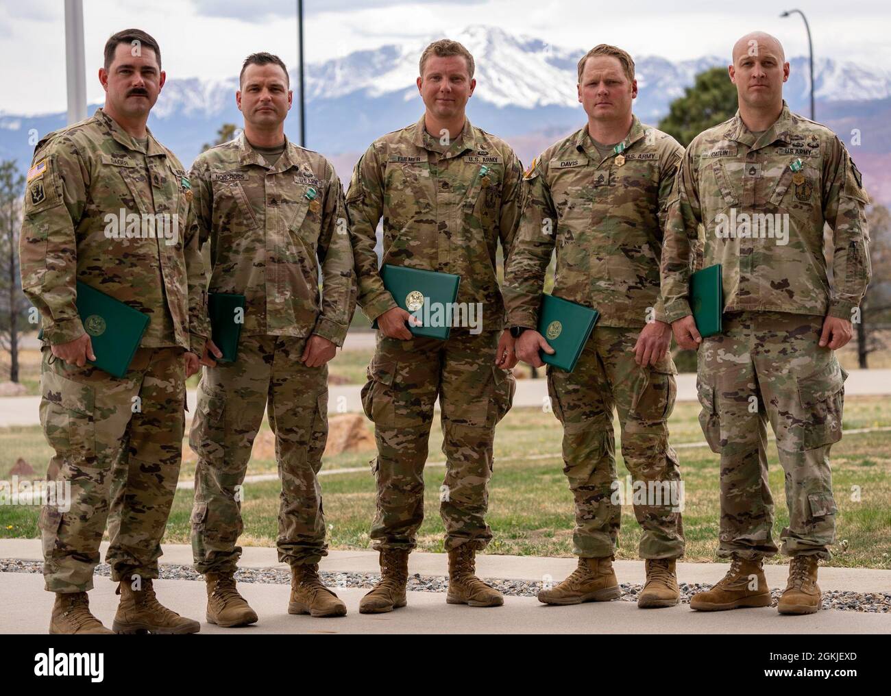 From left to right: U.S. Army Sgt. 1st Class Devin Sager, team coach ...