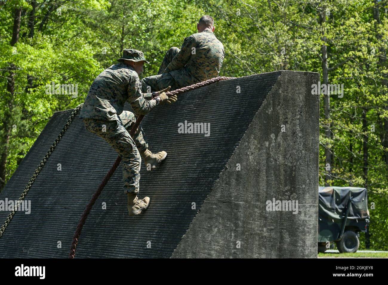 U.S. Marines with The Basic School scale a wall while running the NATO ...