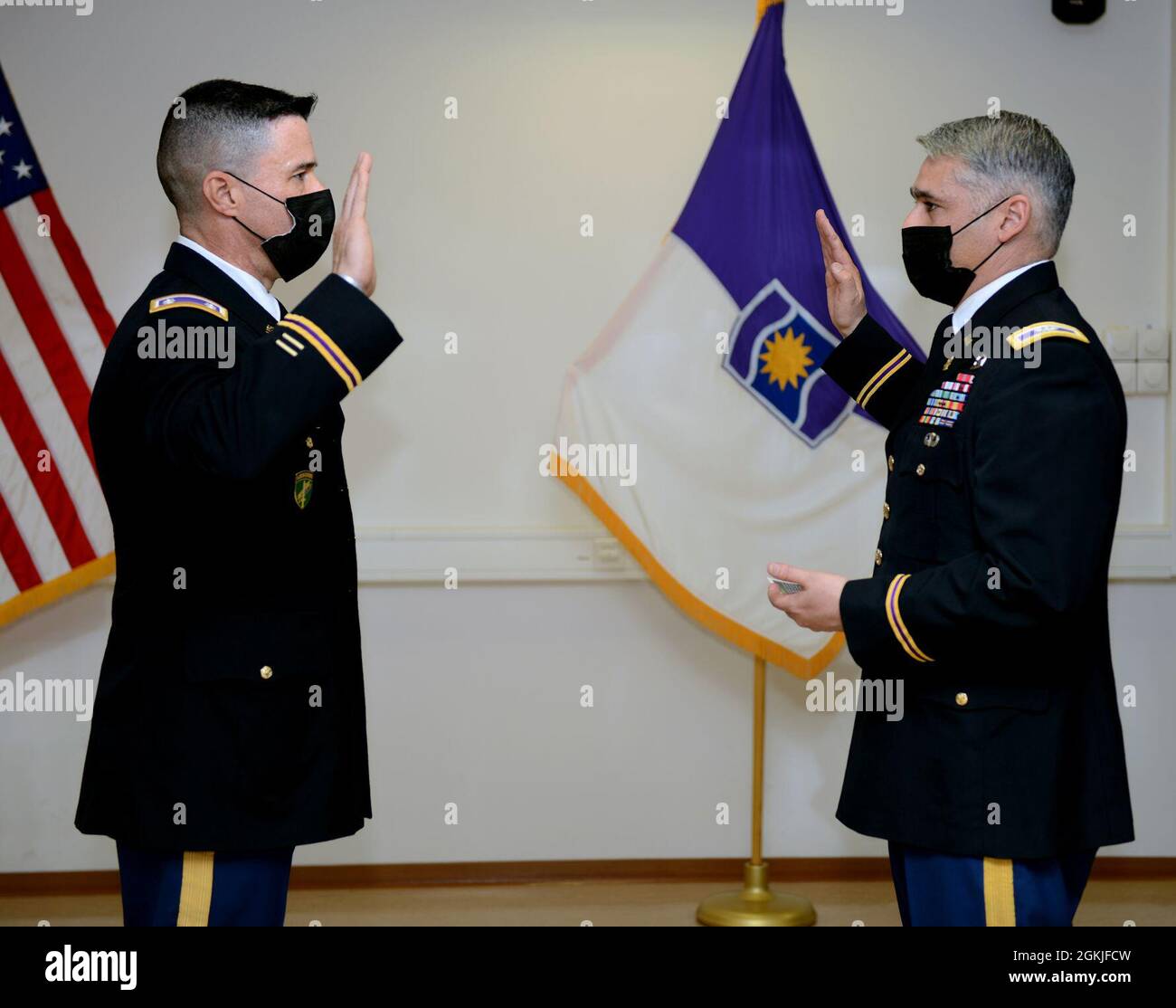 U.S. Army Reserve Col. Carlos E. Gorbea, right, commander of the 361st ...