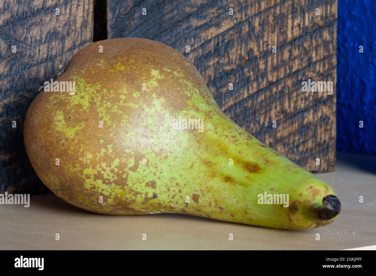 Closeup of a pear fruit on the table Stock Photo - Alamy