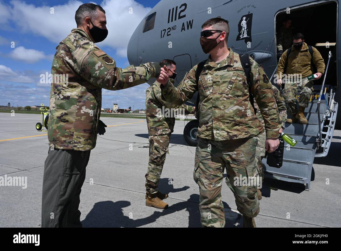 From left: Col. Ryan Ayers, the 119th Operations Group commander, and ...
