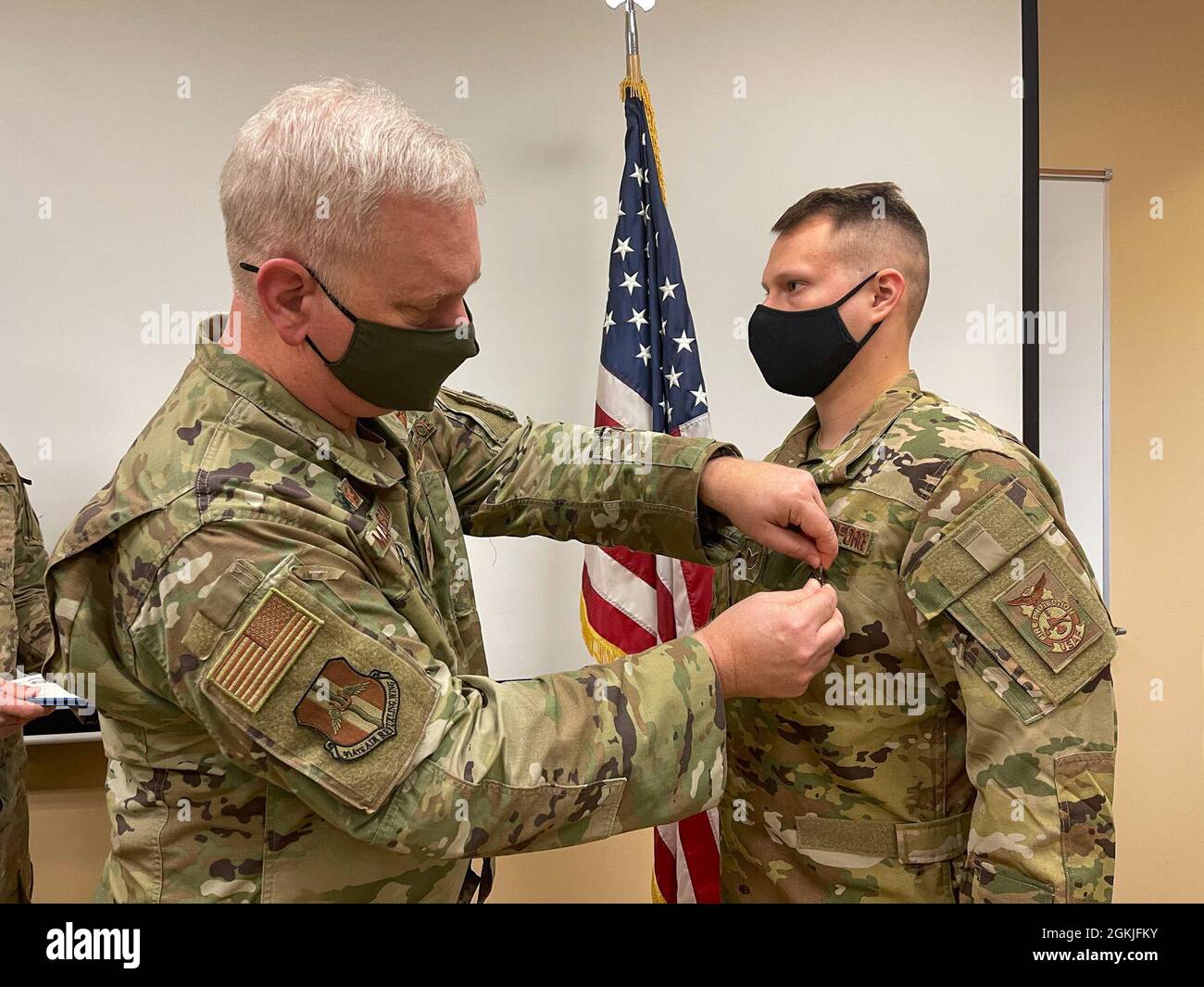 Col. Carl Magnusson, 914th Air Refueling Wing commander, pins the Air ...