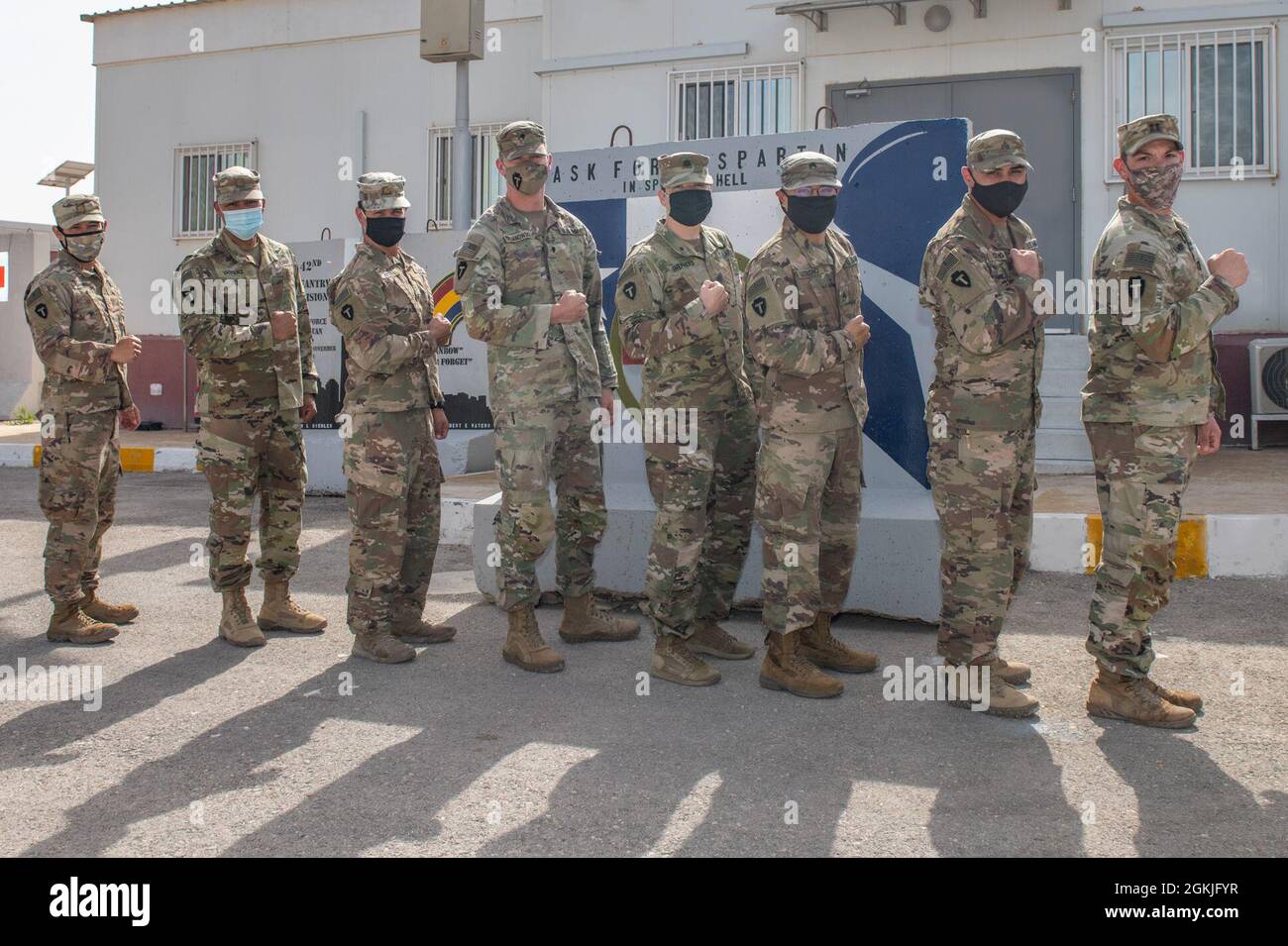 U.S. Army Soldiers from Task Force Spartan flex their right sleeves ...