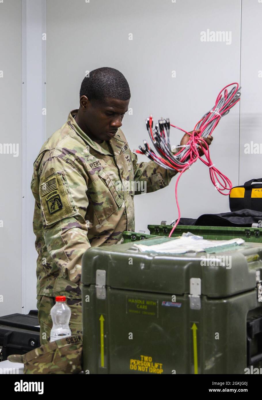 A U.S. Army Paratrooper assigned to 82nd Airborne Division sets up ...