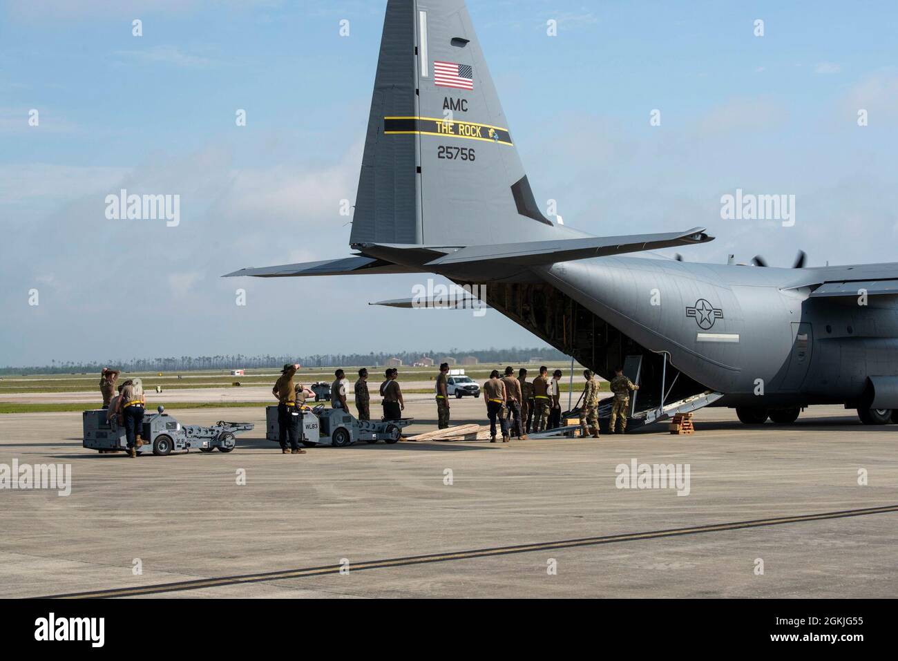 Airmen from the 27th Fighter Squadron weapons load crew load two MJ-1 ...