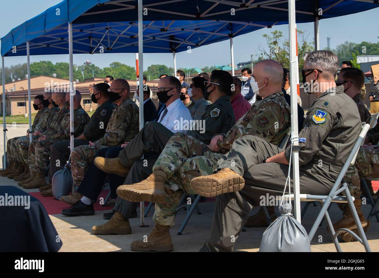 Members of the Osan community gather for a ribbon cutting ceremony at ...