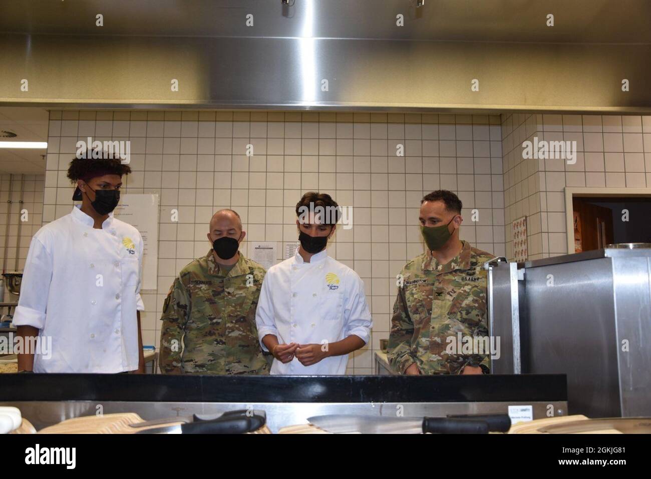 Dom Bivins, left, and Alex Arcila explain to Brig. Gen. Jed Schaertl ...