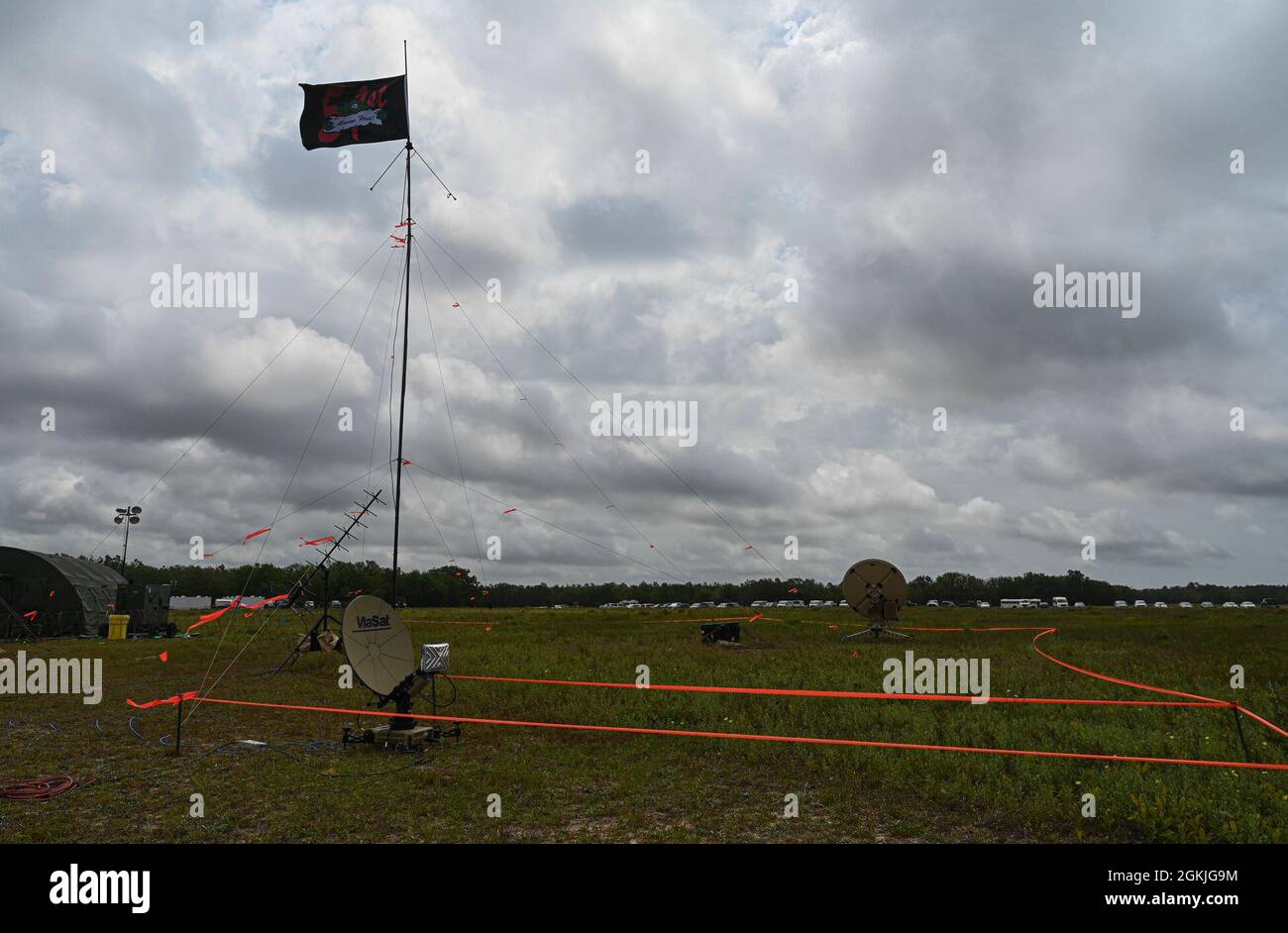 Communications equipment is set in a field at the Agile Flag 21-2 ...