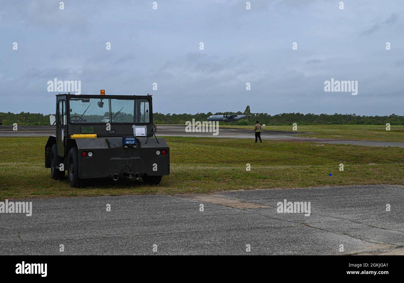 A U.S. Air Force Airman walks toward the flight line during the Agile ...