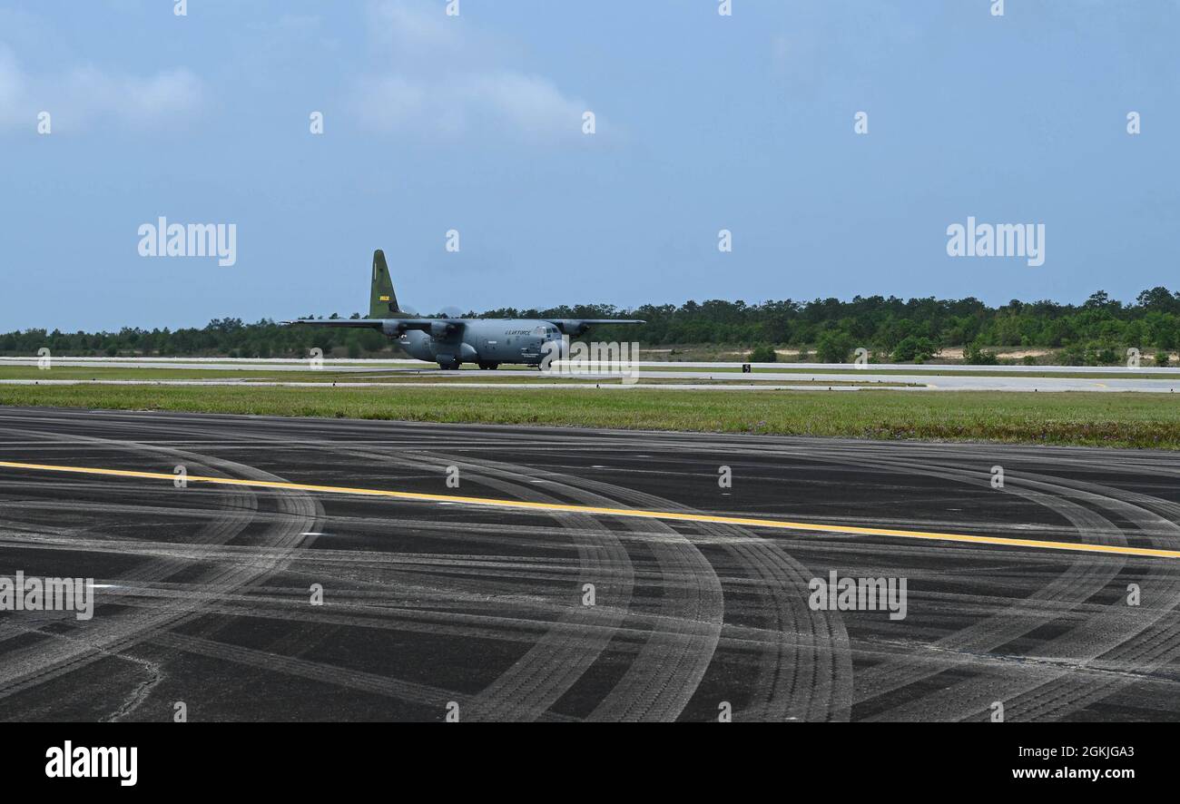 A U.S. Air Force C-130 Hercules, lands at Naval Outlying Landing Field ...