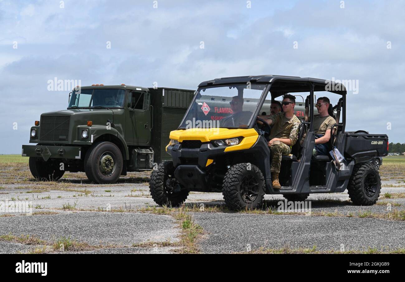 U.S Air Force Airmen wait to fuel incoming aircraft at Naval Outlying ...