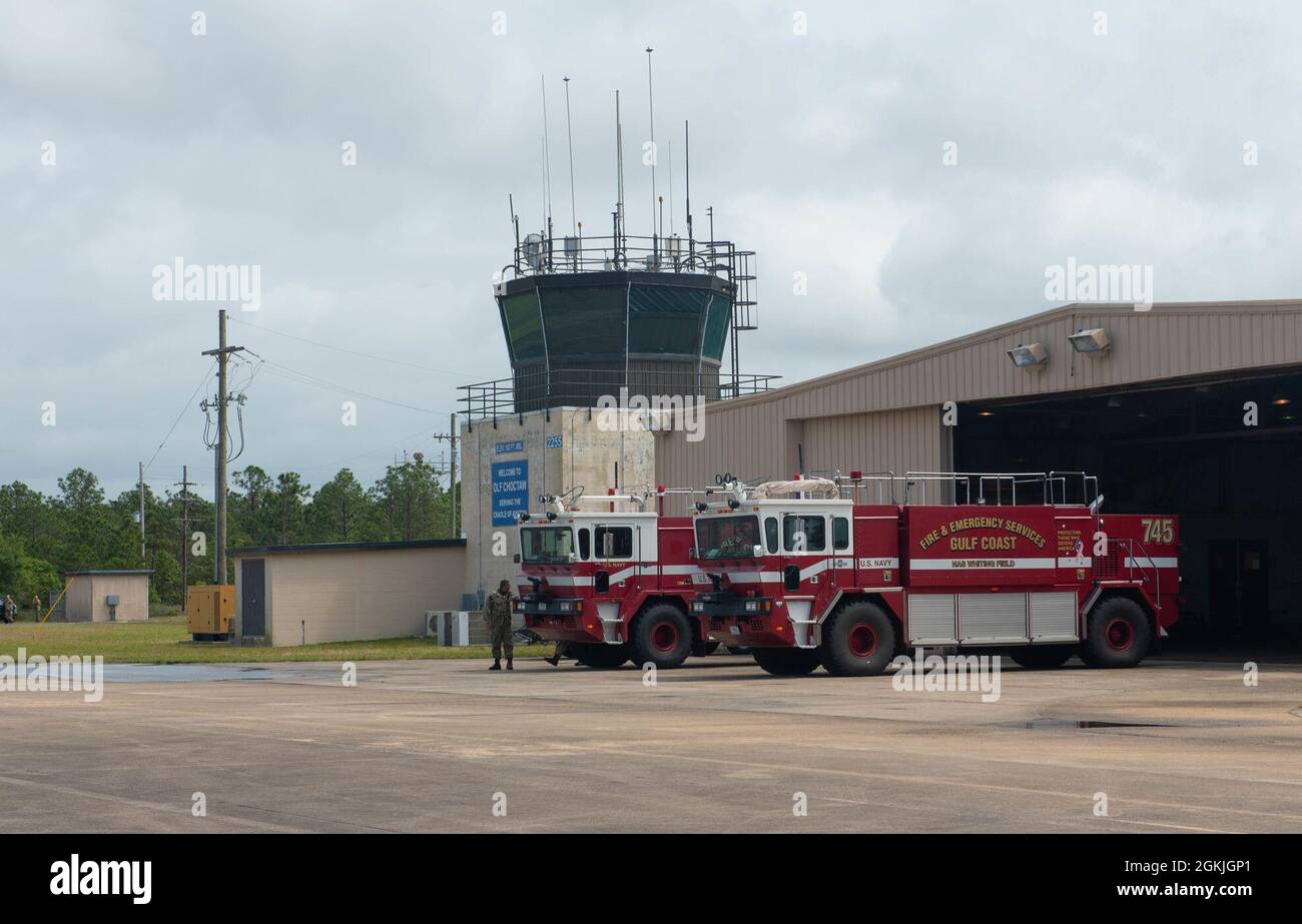 U.S. Navy Fire and Emergency Services Gulf Coast fire engines stand ...