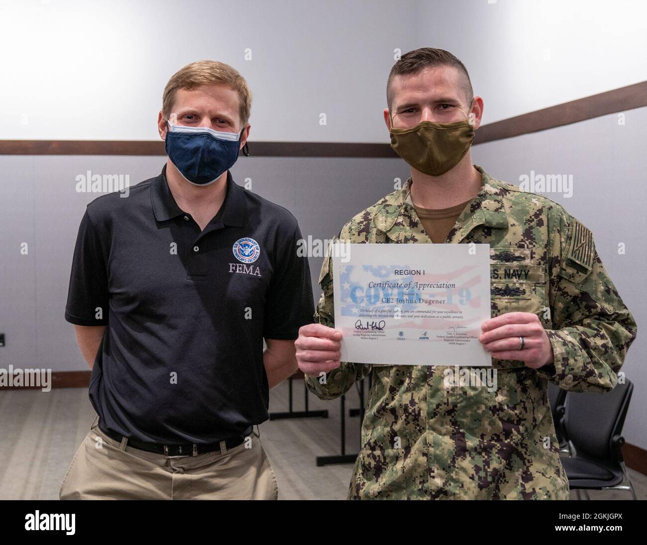 U.S. Navy Petty Officer 2nd Class Joshua Dugener, right, an Ovid ...