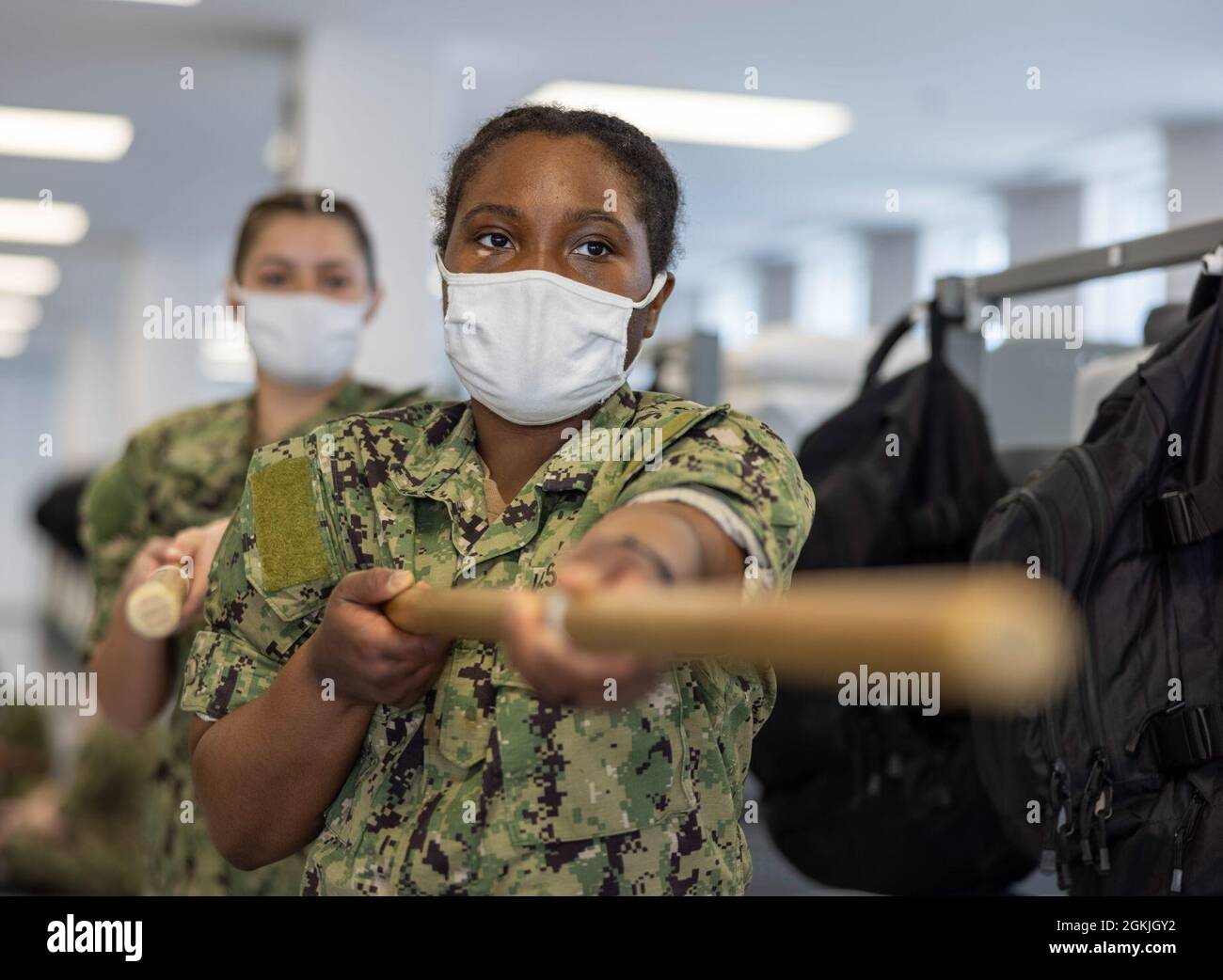 A recruit guideon presents arms during drill practice inside a ...