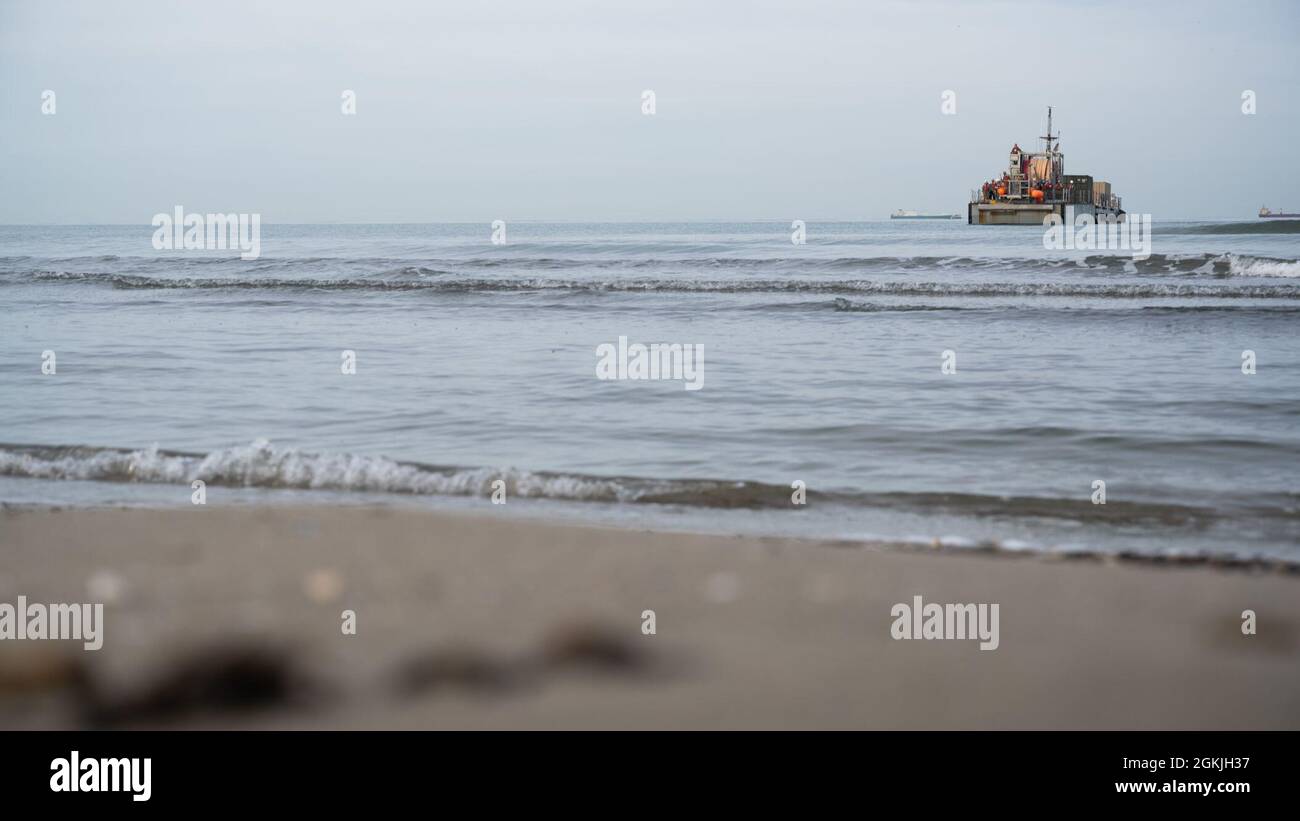 An Improved Navy Lighterage System (INLS) causeway ferry approaches the ...