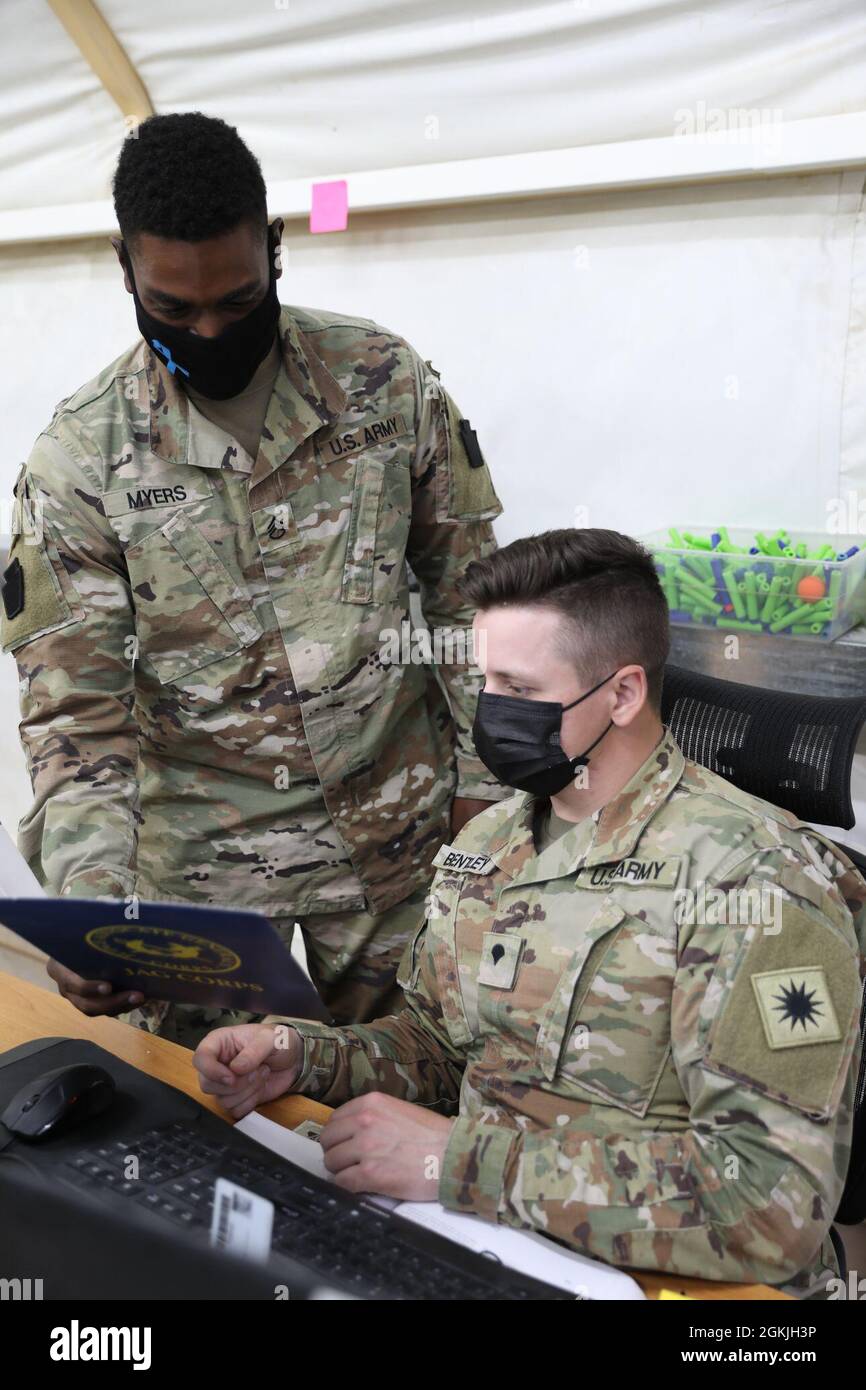 Staff Sgt. Charles Myers (left), a Paralegal Non-commissioned officer ...