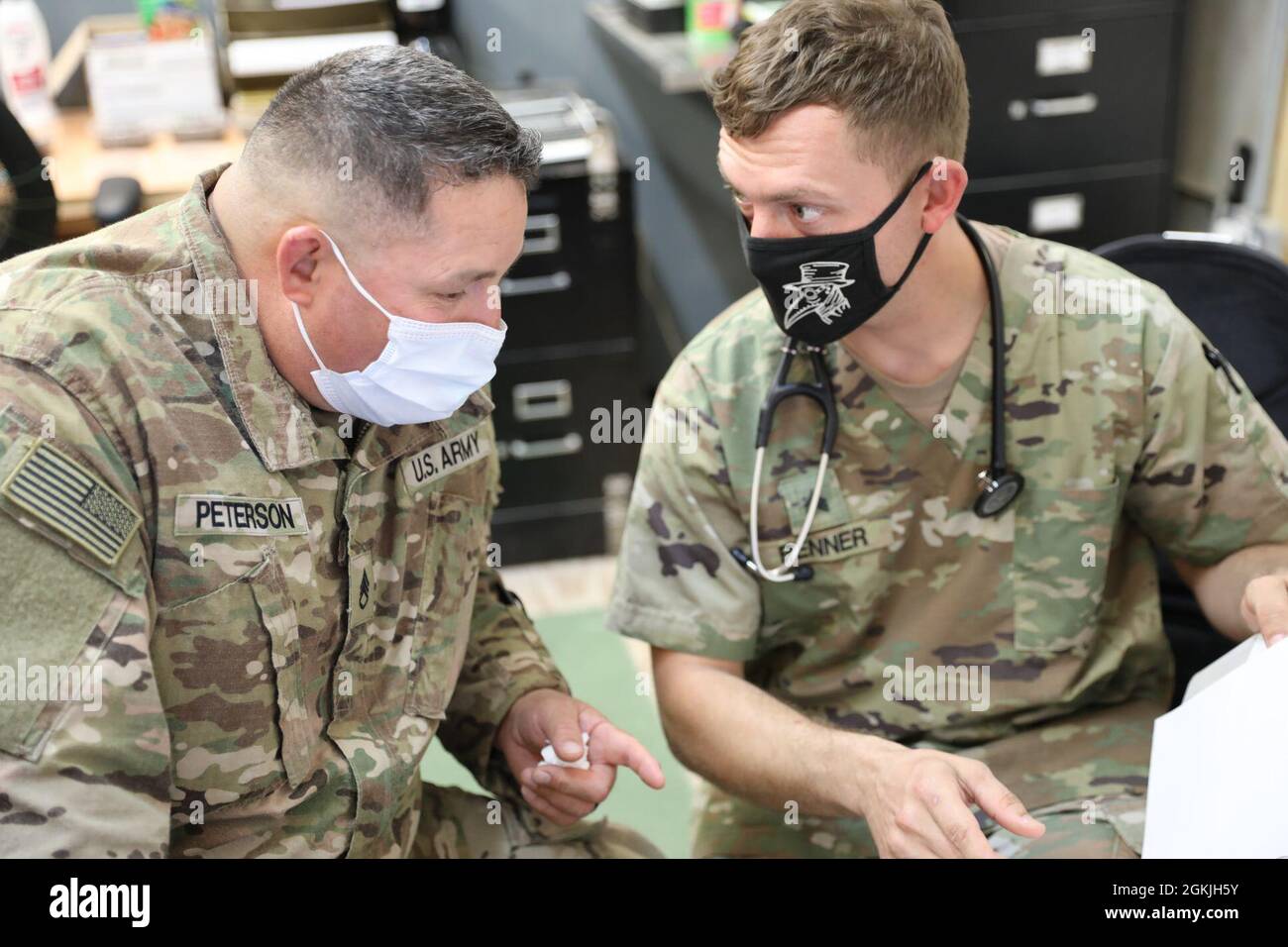 Sgt. Jesse Benner (right), a Medical Aid Station Non-commissioned ...
