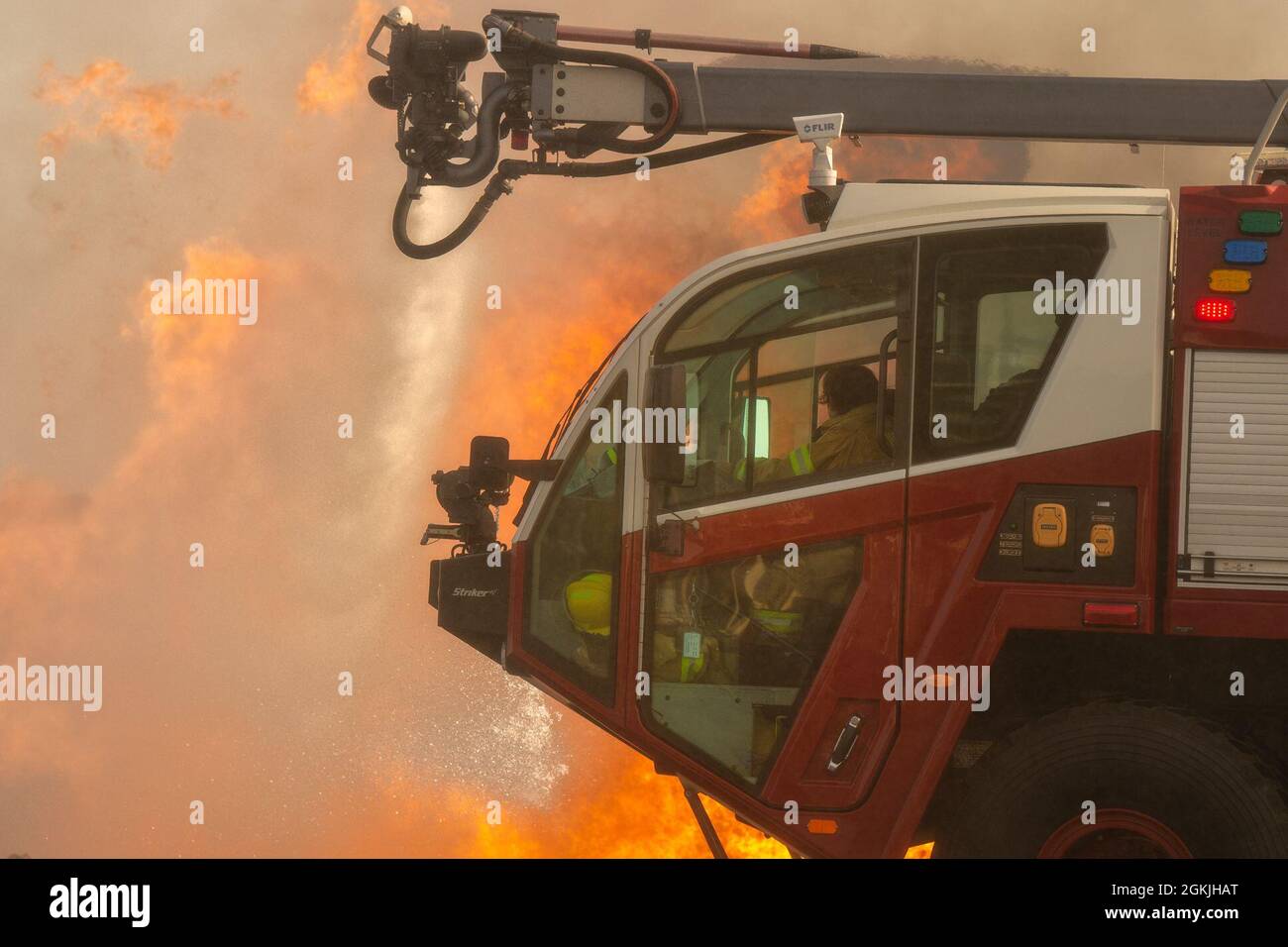 Firefighters with the 374th Civil Engineer Squadron operate a fire ...
