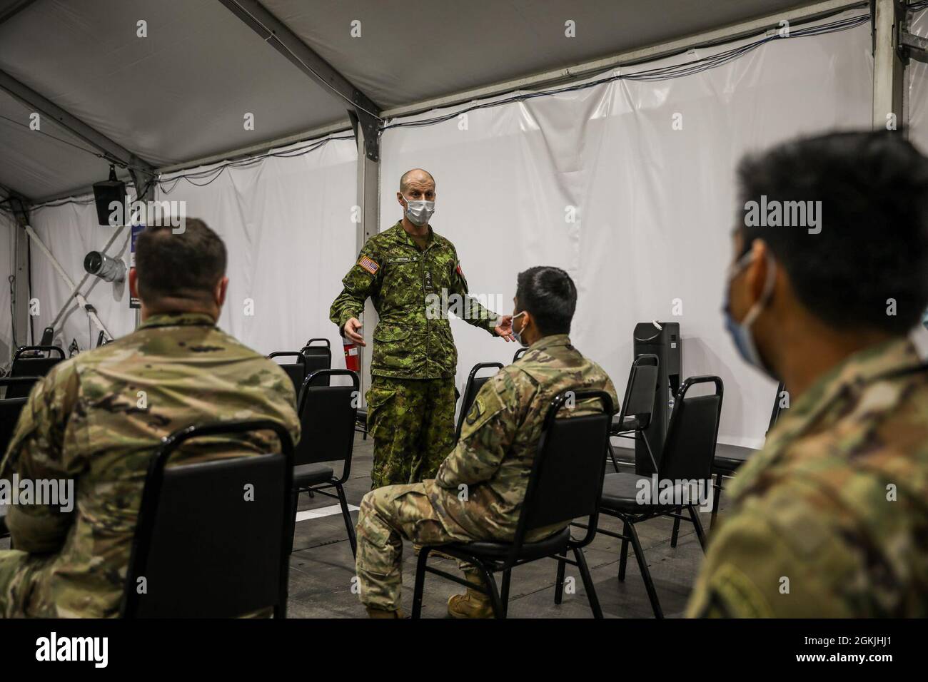Canadian Army Brig. Gen. R.T. Ritchie, center, Assistant Commanding ...