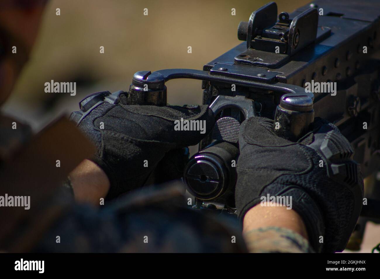 A U.S. Marine with Marine Rotational Force - Darwin fires a M2 heavy ...