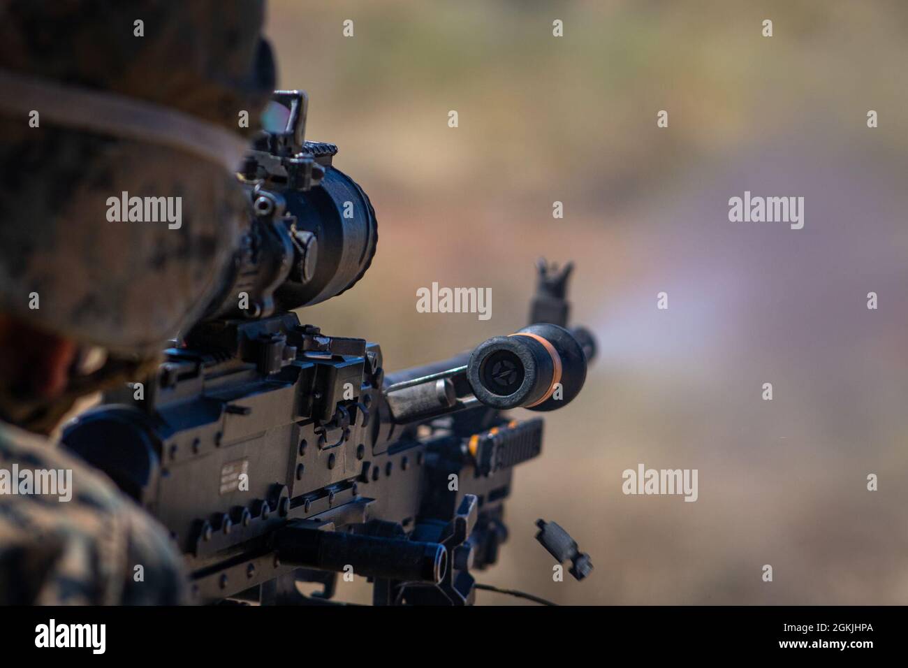 A U.S. Marine with Marine Rotational Force - Darwin fires a M240B ...