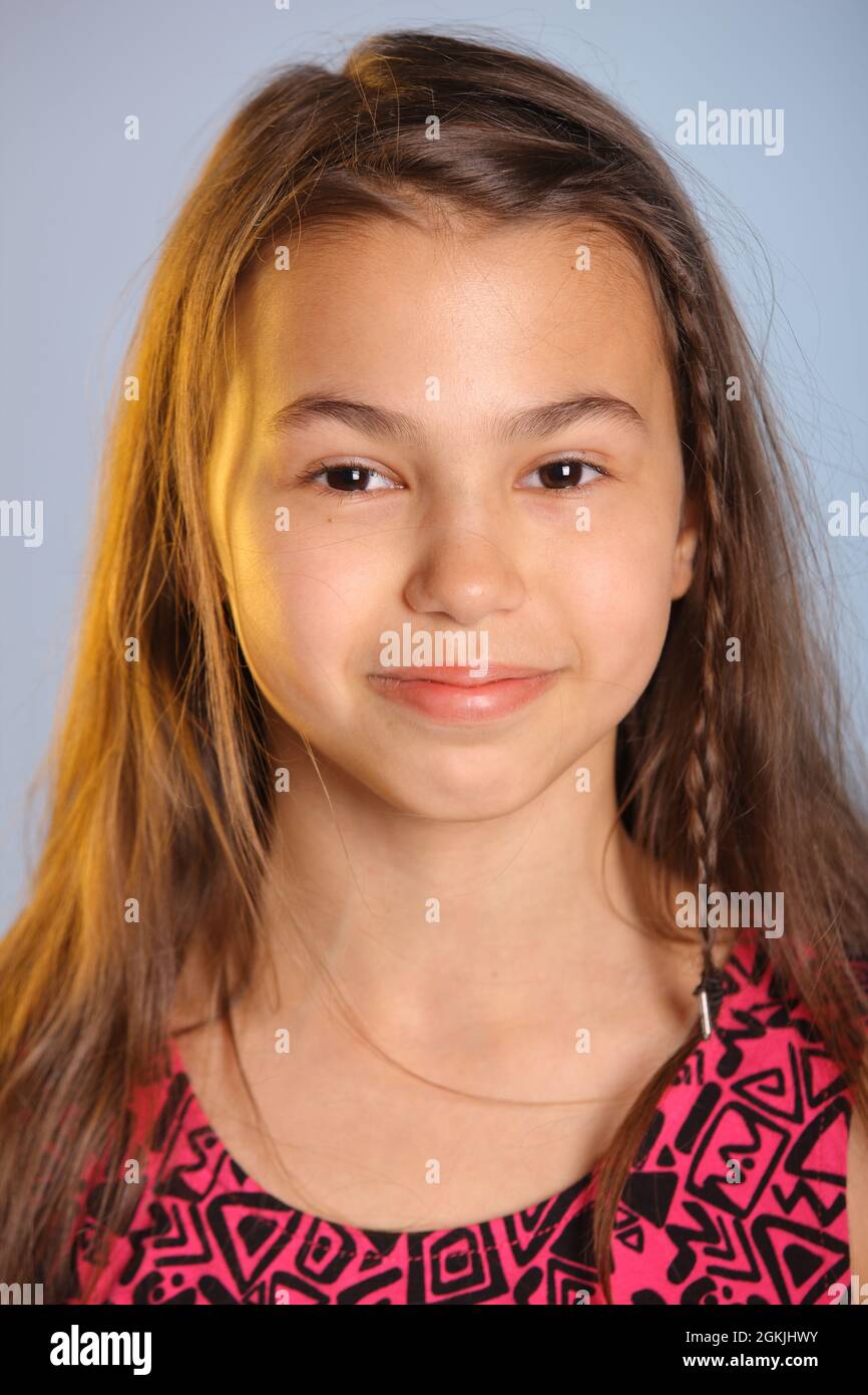 Close-up portrait of a bright cute dark-haired teenage girl 12 years ...