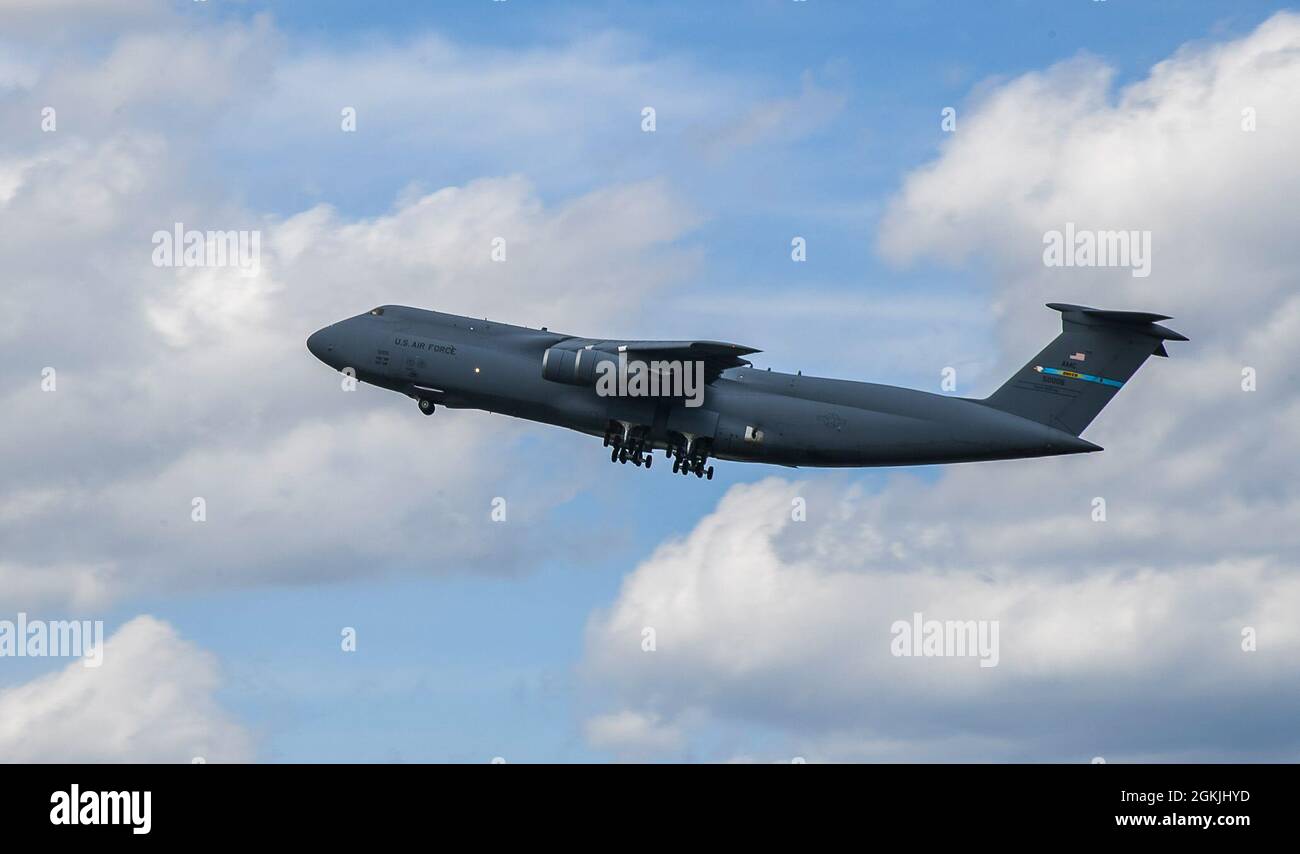 Col. Matthew Jones, 436th Airlift Wing commander, pilots a C-5M Super ...