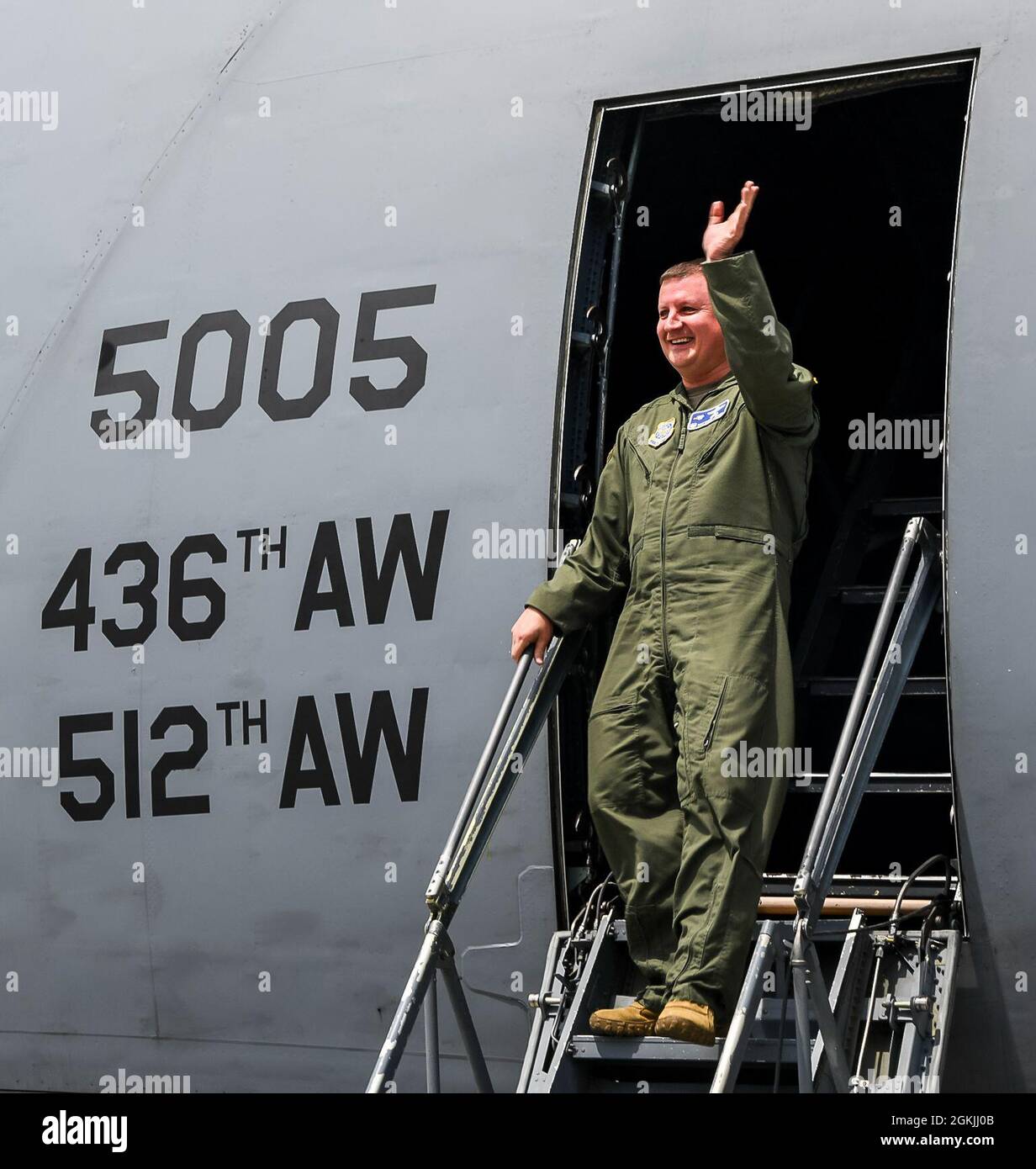 Col. Matthew Jones, 436th Airlift Wing commander, waves to family and ...