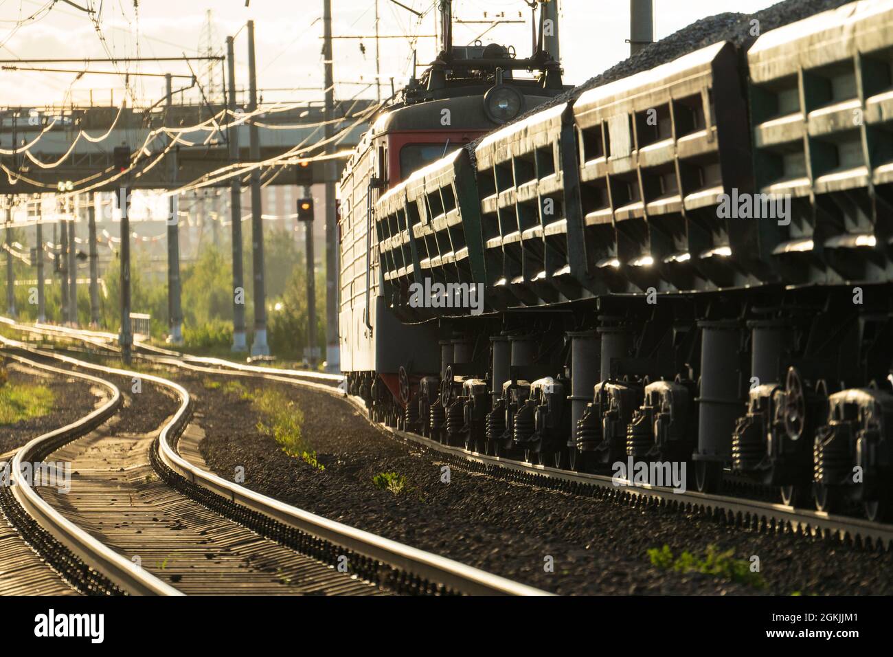 Freight train on rails. Wagons with delivery of ore, crushed stone ...