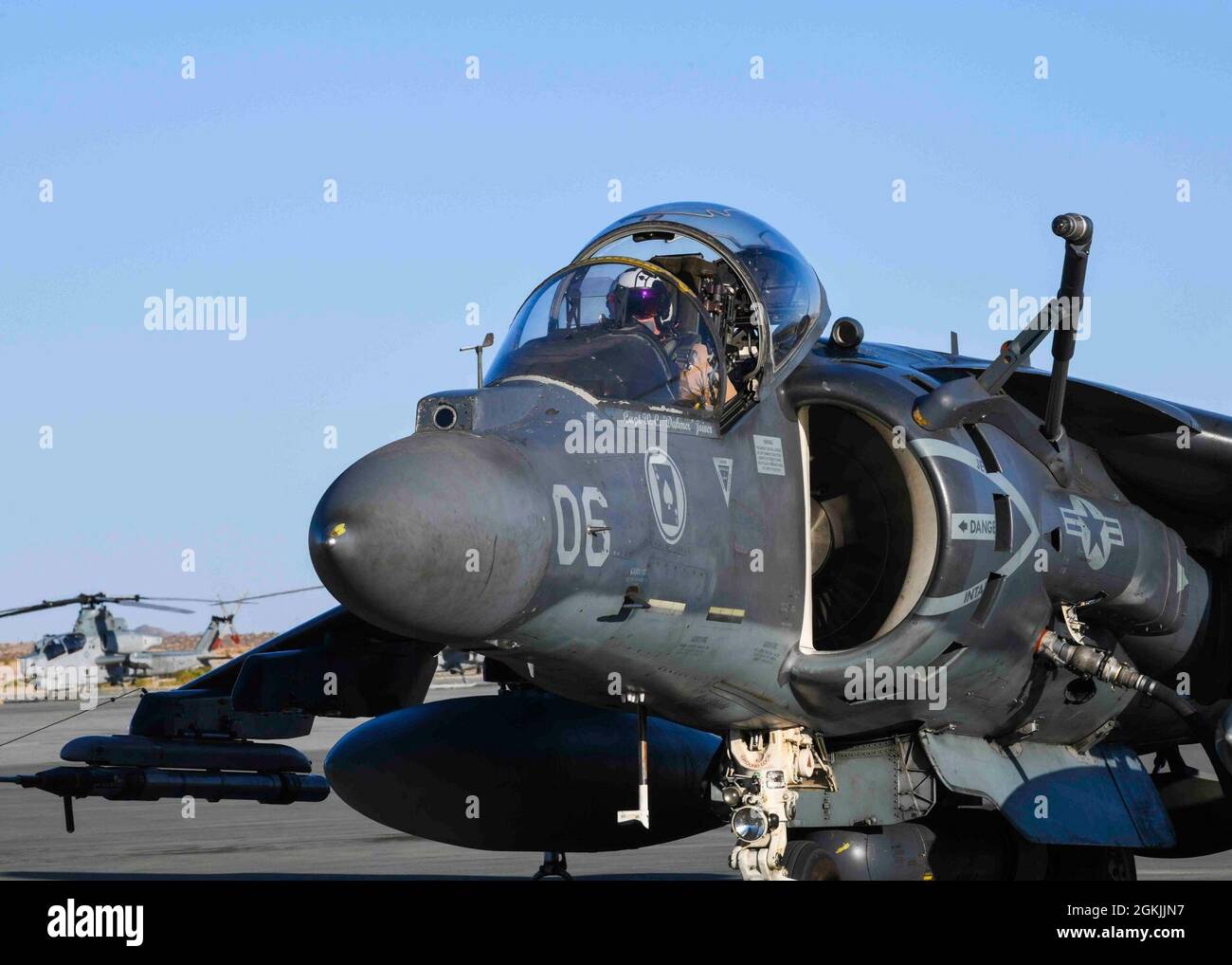 A U.S. Marine parks a Harrier Jump Jet to prepare for hot pit refueling ...